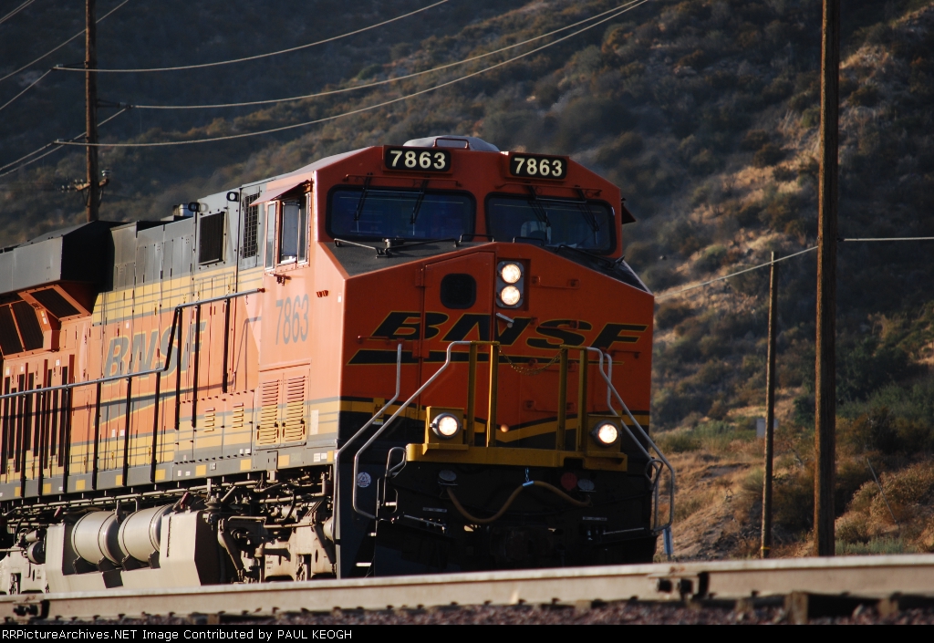 Zoom in shot of the crew and the LED lights of BNSF 7863 as she rolls west leading a Z-Train.